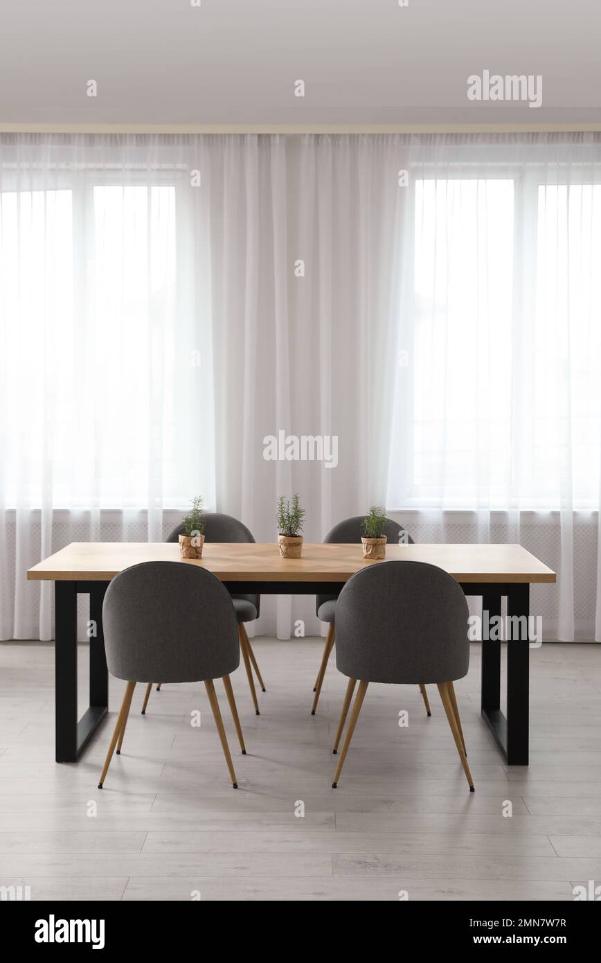 Modern room interior with chairs and table Stock Photo - Alamy
