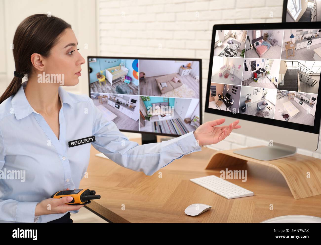 Female security guard with portable transmitter at workplace Stock ...