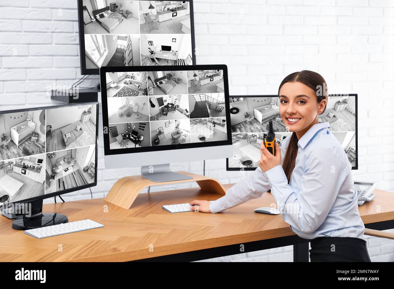 Female security guard with portable transmitter at workplace Stock ...