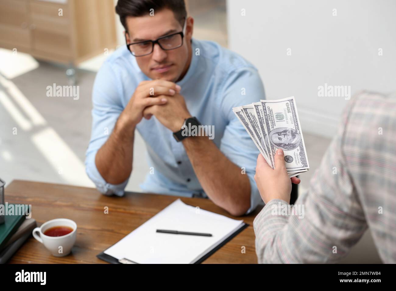 Woman offering bribe businessman hi-res stock photography and images ...