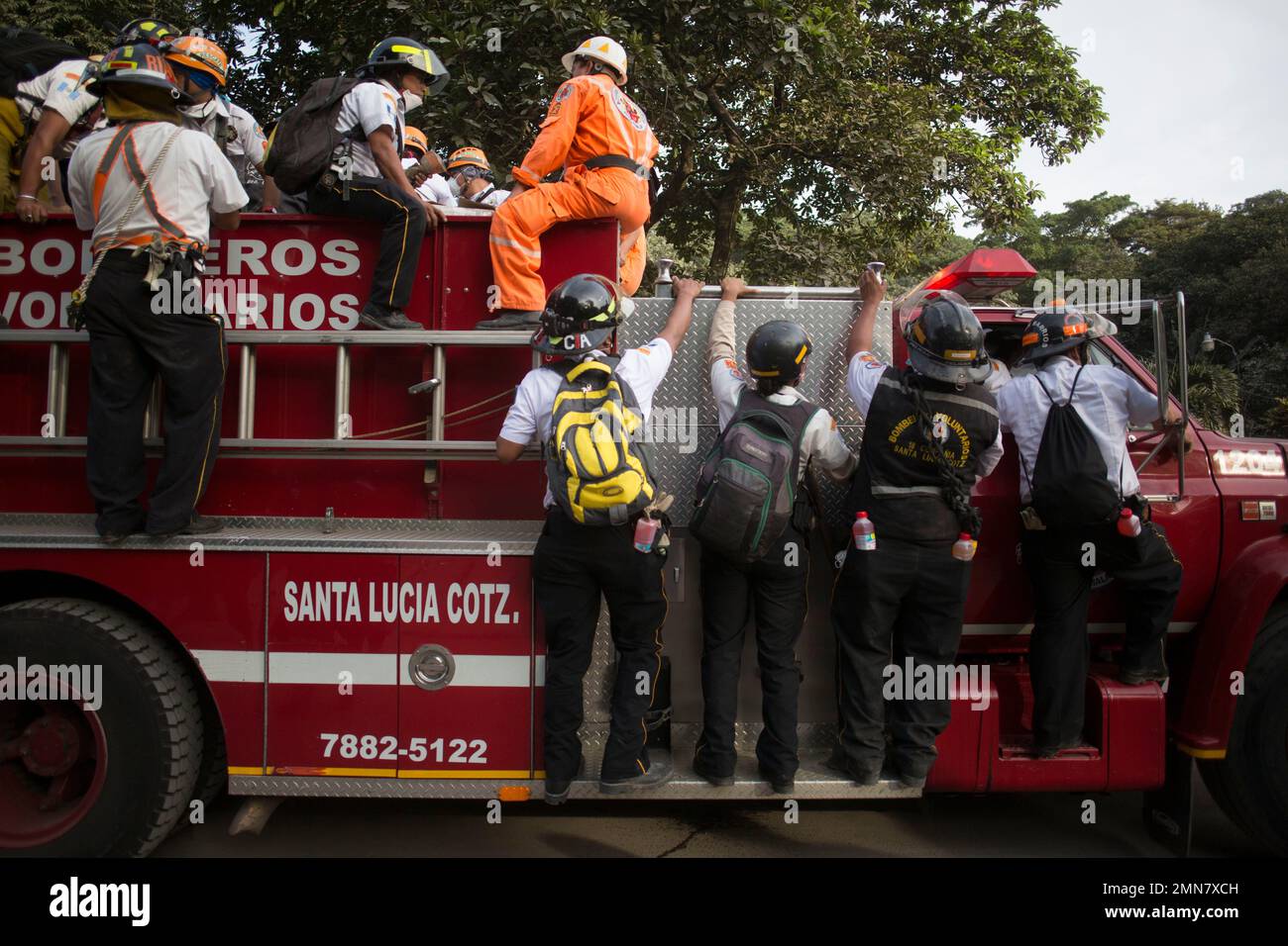 Firefighters enter the rescue area near Volcan de Fuego, or Volcano of ...