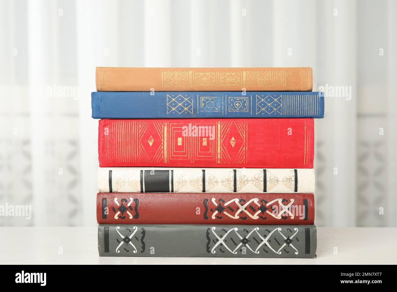 Collection of different books on table indoors Stock Photo - Alamy