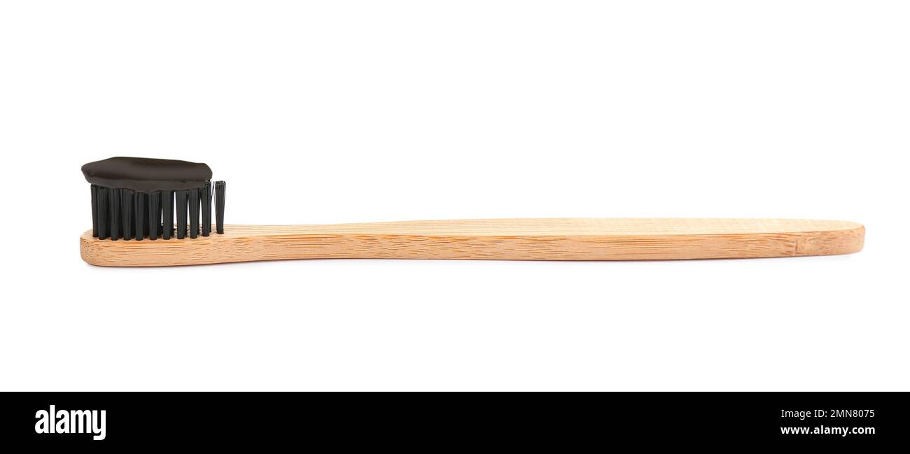 Bamboo toothbrush with charcoal paste isolated on white Stock Photo - Alamy