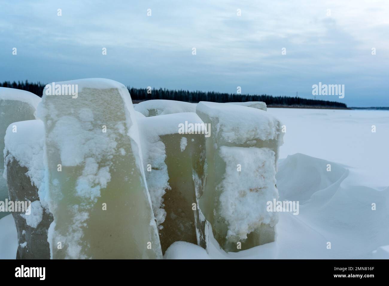 Heaps of columns of ice for defrosting and eating stands covered with ...