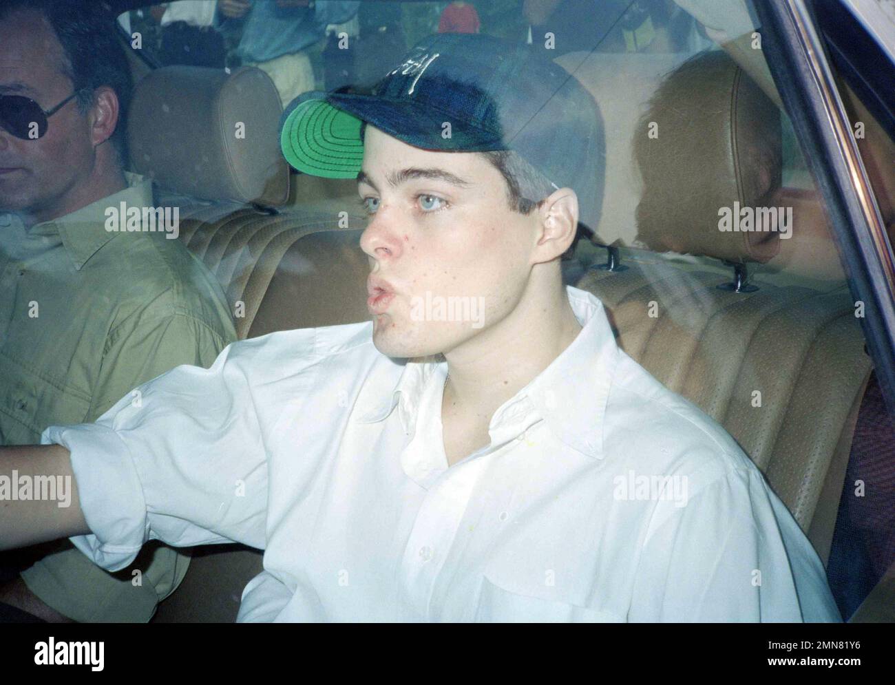 American Michael Fay is driven out of the Queenstown prison in ...