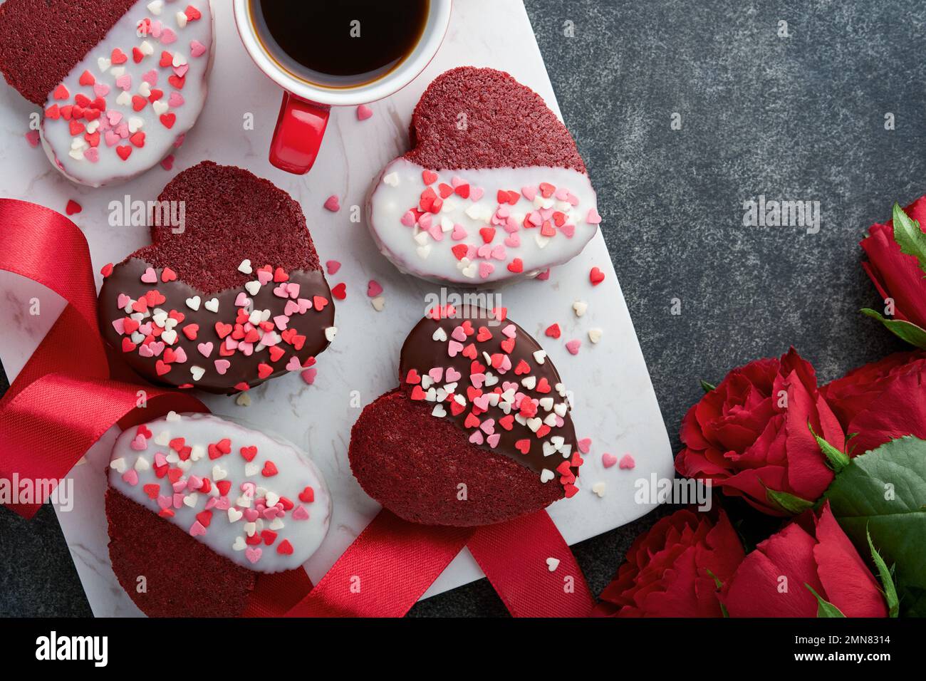 Red velvet or brownie cookies on heart shaped in chocolate icing with ...