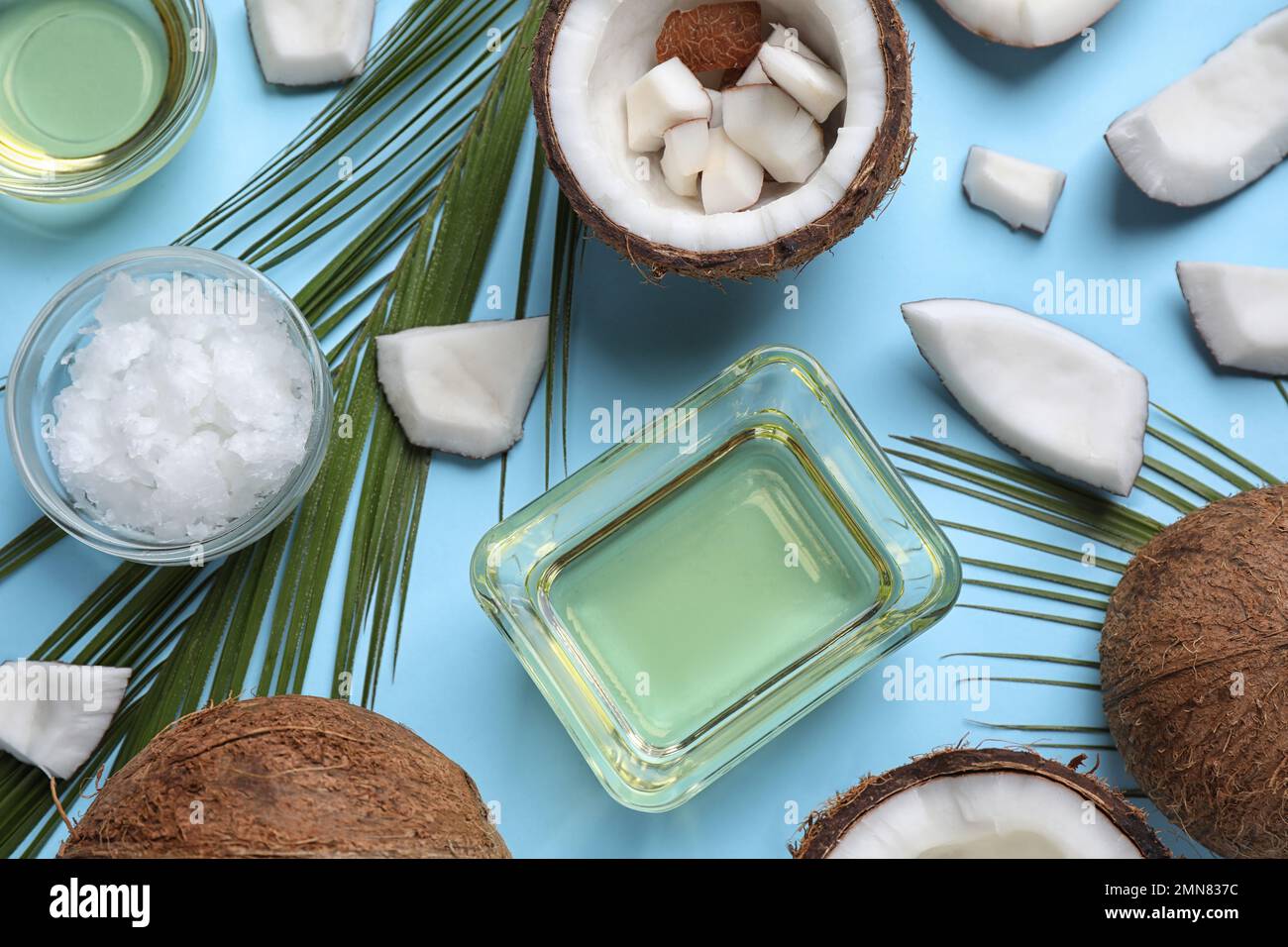 Flat lay composition with coconut oil on light blue background Stock ...