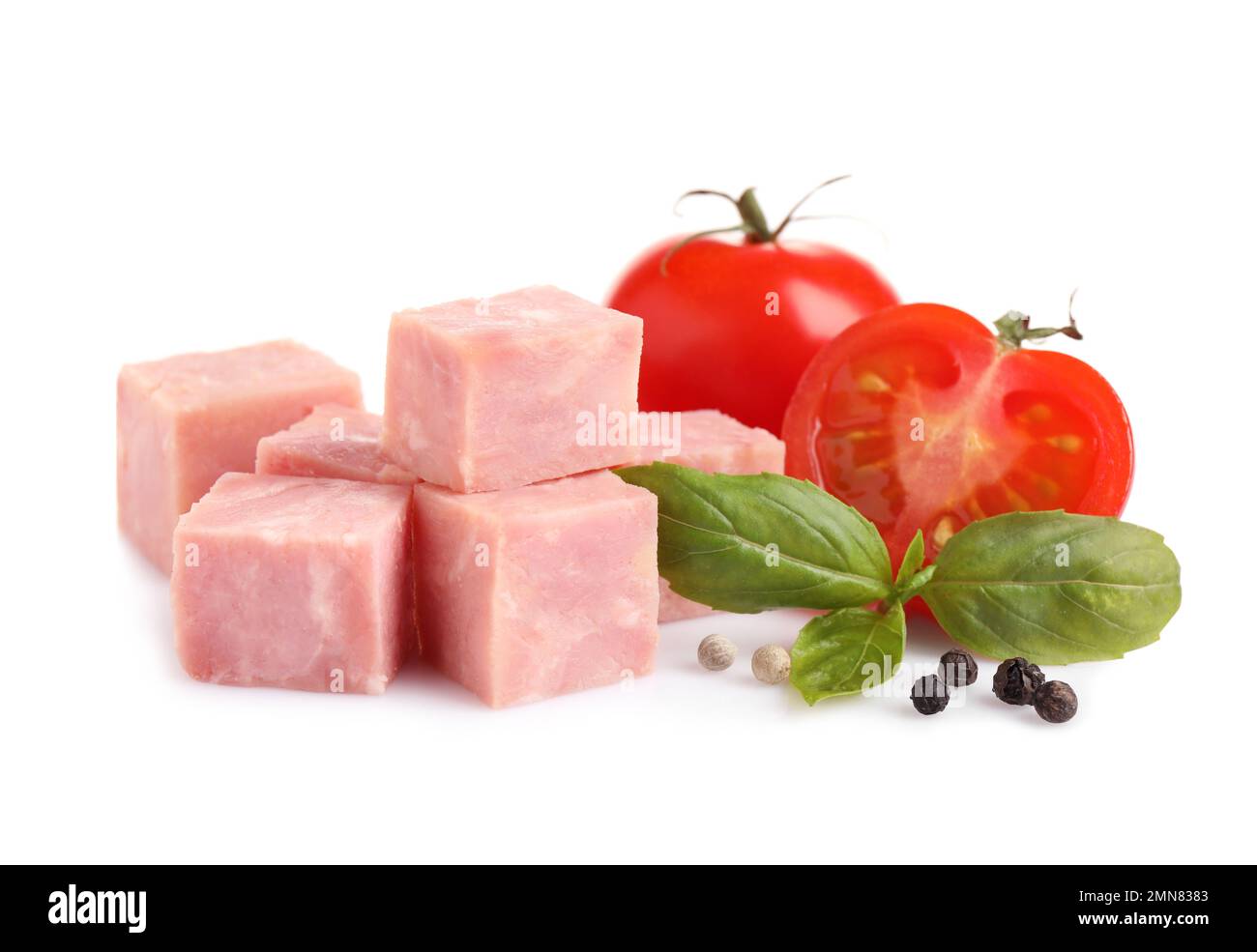 Cubes of tasty fresh ham with basil, tomatoes and pepper isolated on ...