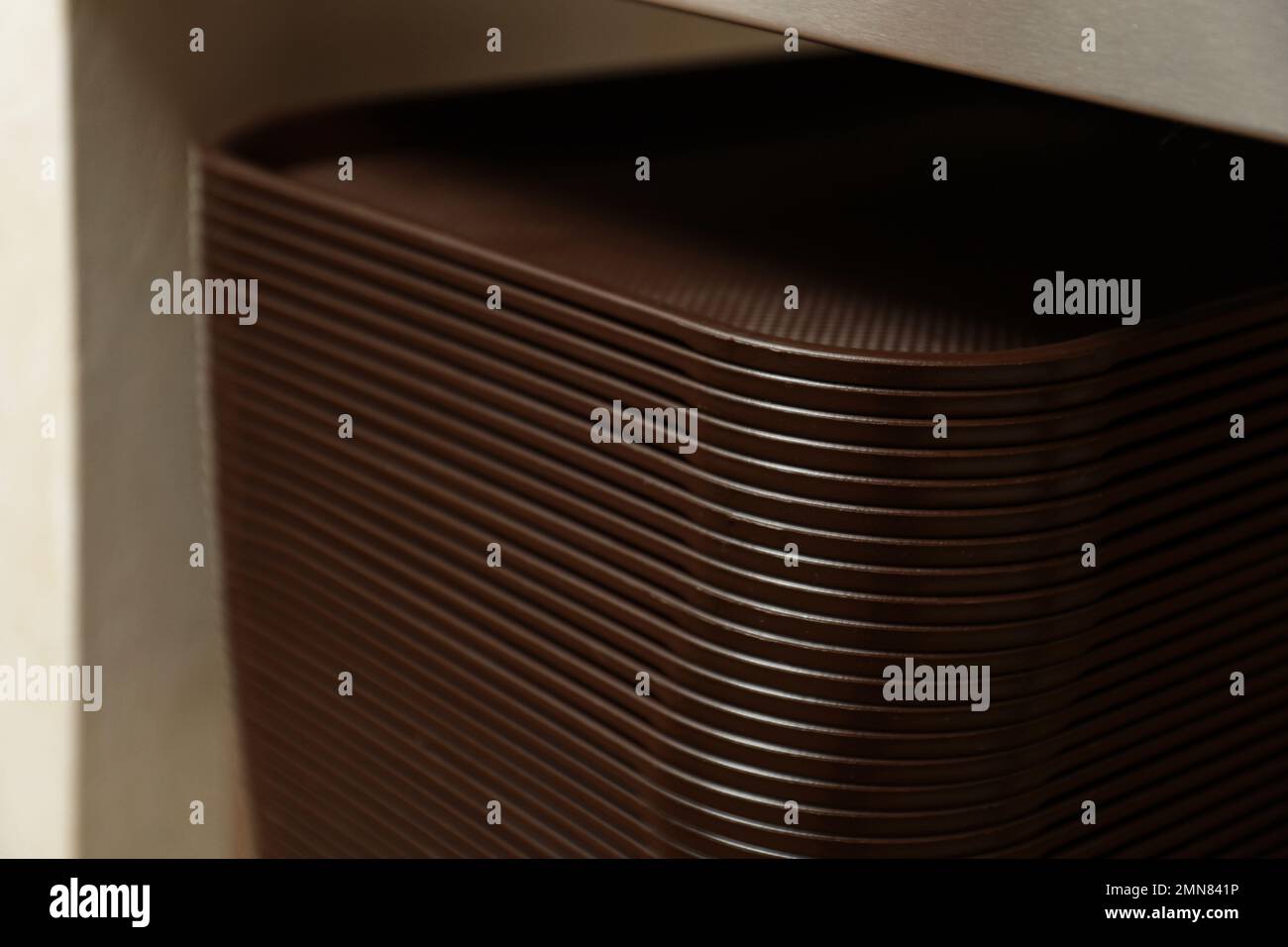 Stack of plastic trays for food in school canteen Stock Photo - Alamy