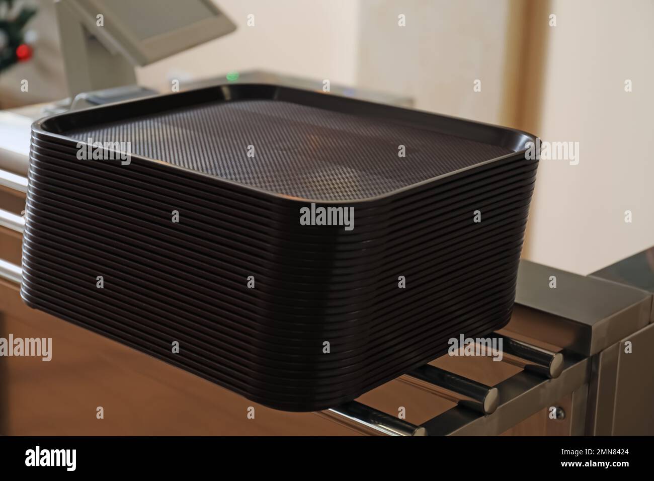 Stack of plastic trays for food in school canteen Stock Photo - Alamy