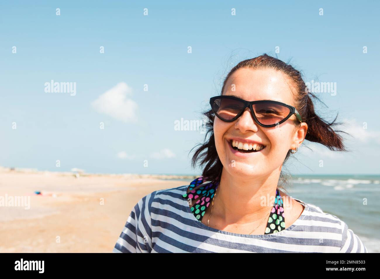 Woman smiles laughs looks sky hi-res stock photography and images - Alamy