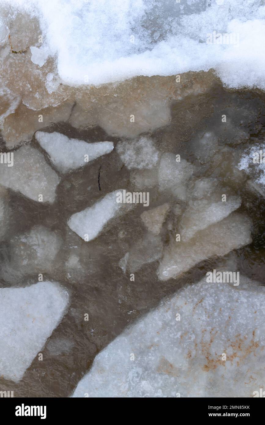 Photo texture of water, white snow and ice. Background. Vertical ...