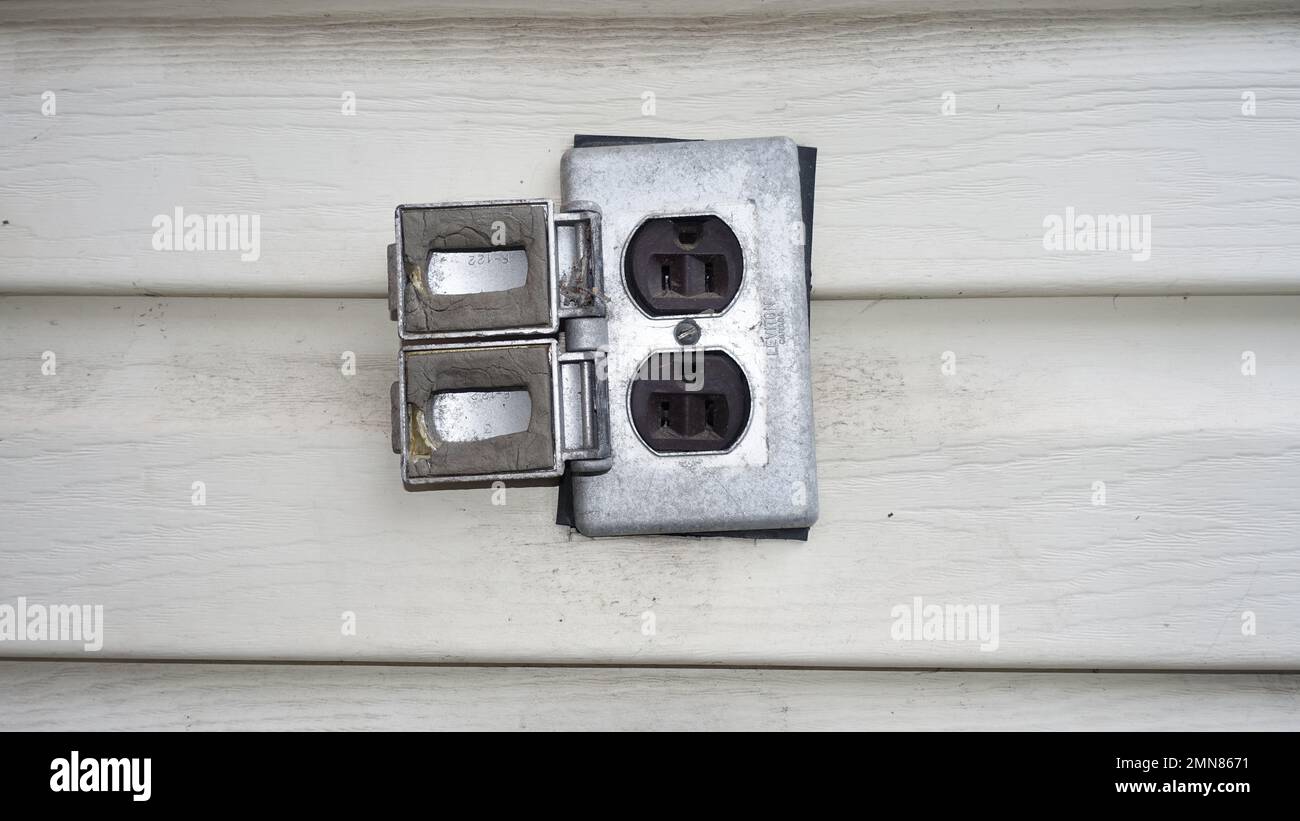 Electricity exterior wall plug socket Stock Photo - Alamy