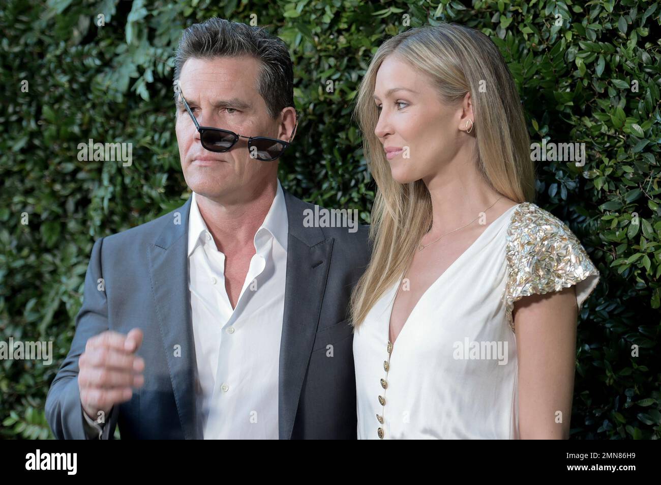 Josh Brolin, left, and Kathryn Boyd attend Chanel and NRDC Host Dinner ...