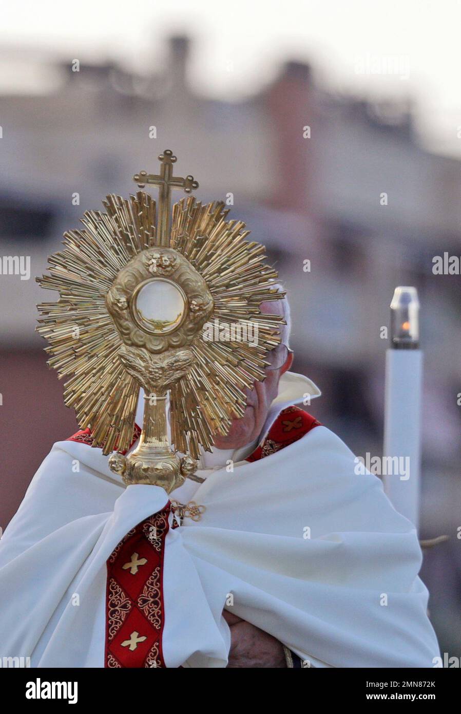 Pope Francis holds a monstrance as he celebrates the Holy Mass during a ...
