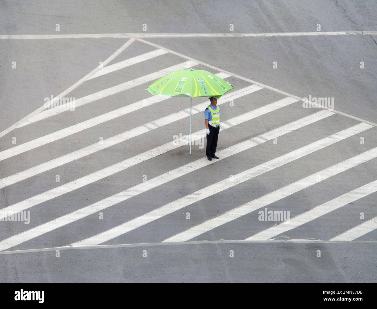 Somewhat isolated and perhaps lonely traffic officer policeman at a ...