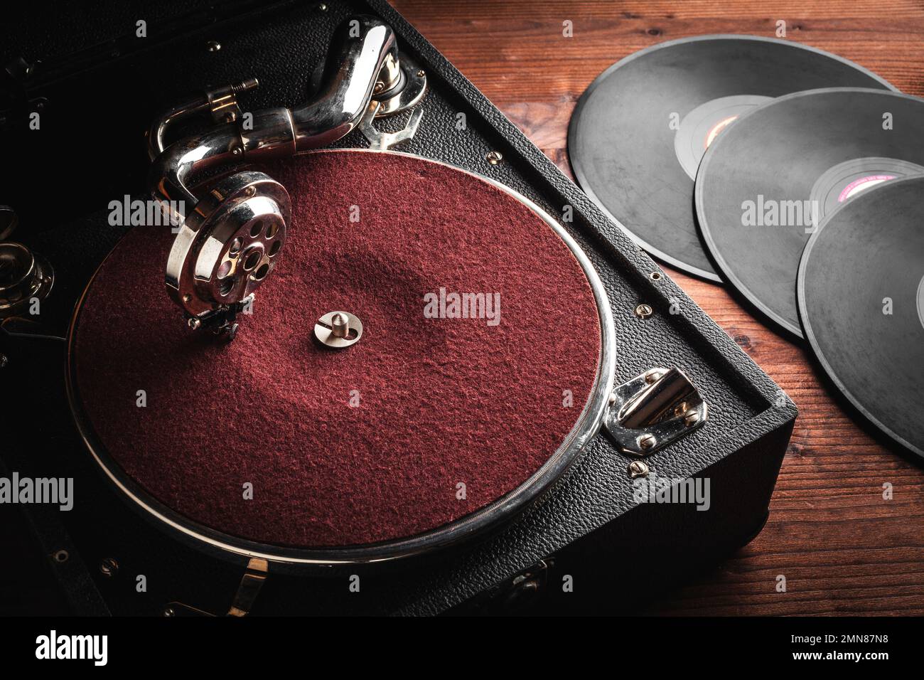 Retro portable turntable with vynil on wood table Stock Photo - Alamy