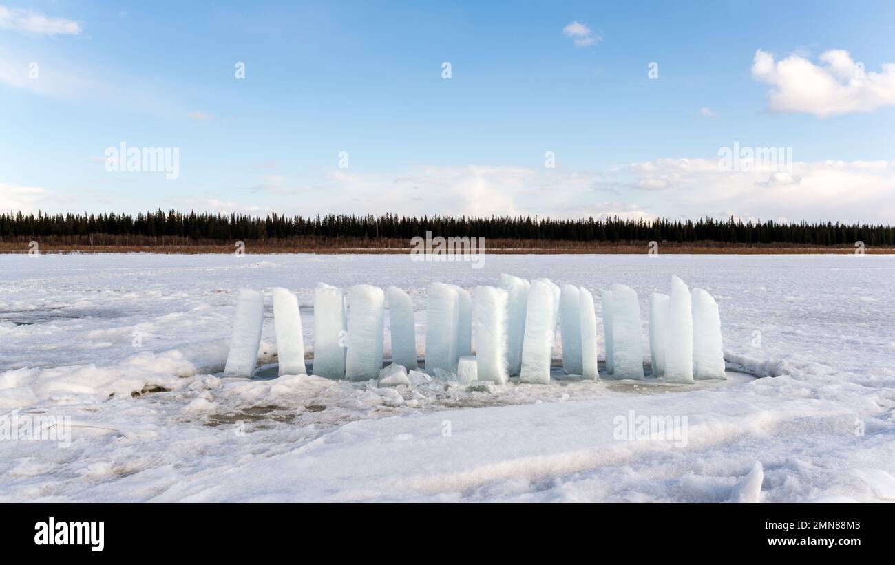 Cut ice with pillars for defrosting and eating stands covered with snow ...