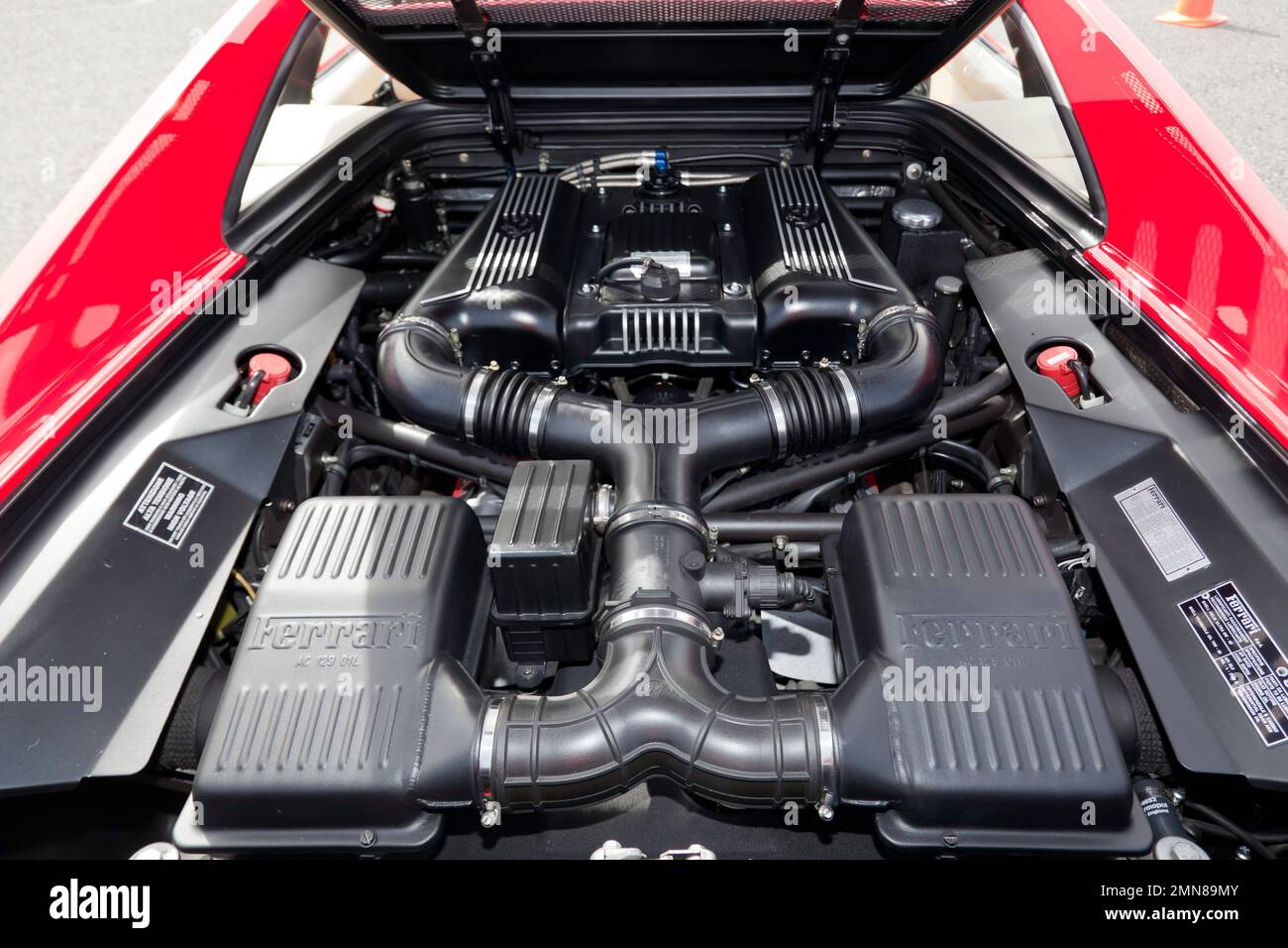 View Of The Engine Bay Of A Red 1998 Ferrari F355 On Display At The