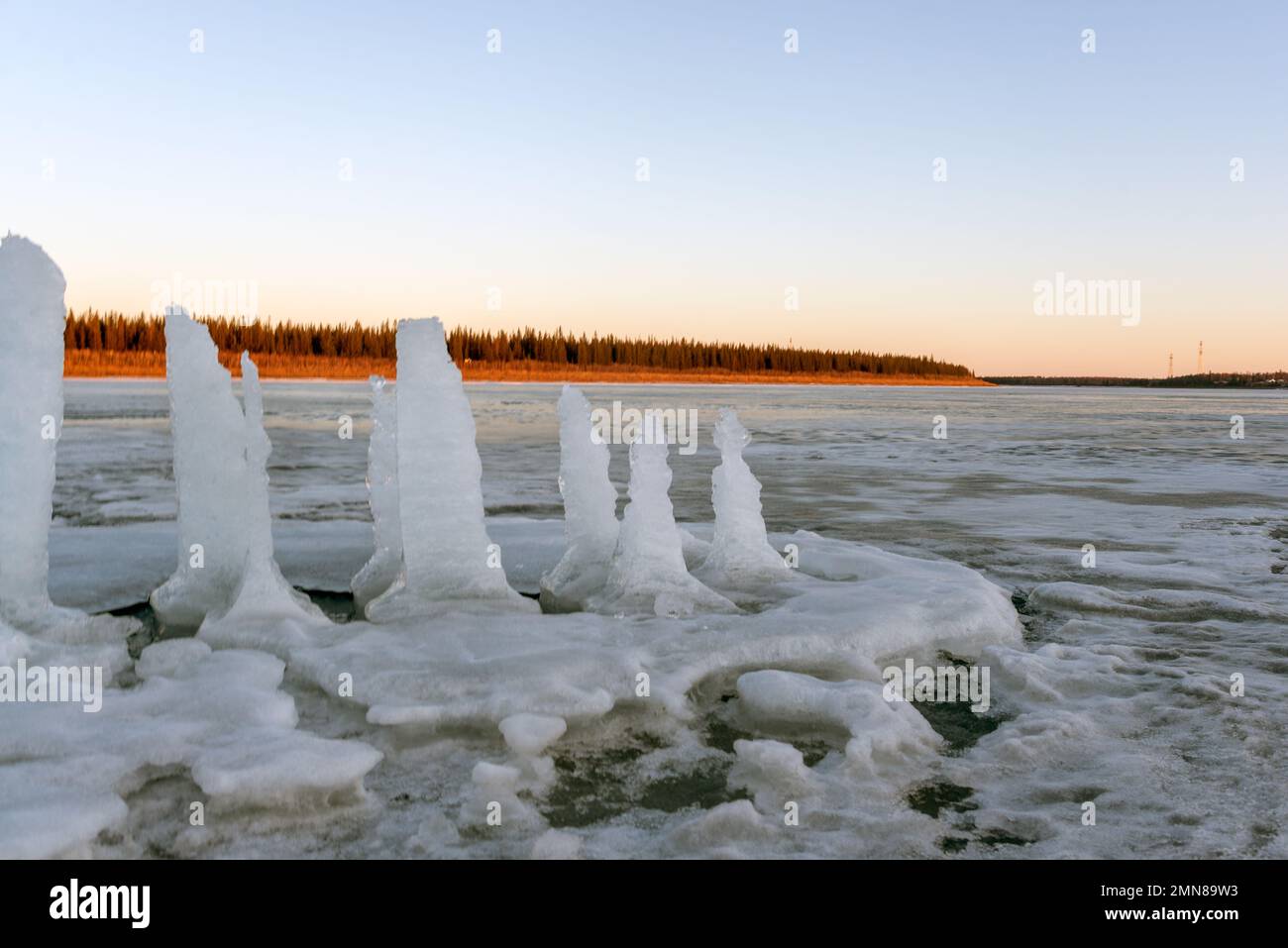 The remains of pillars of ice cut out for drinking water melt standing ...