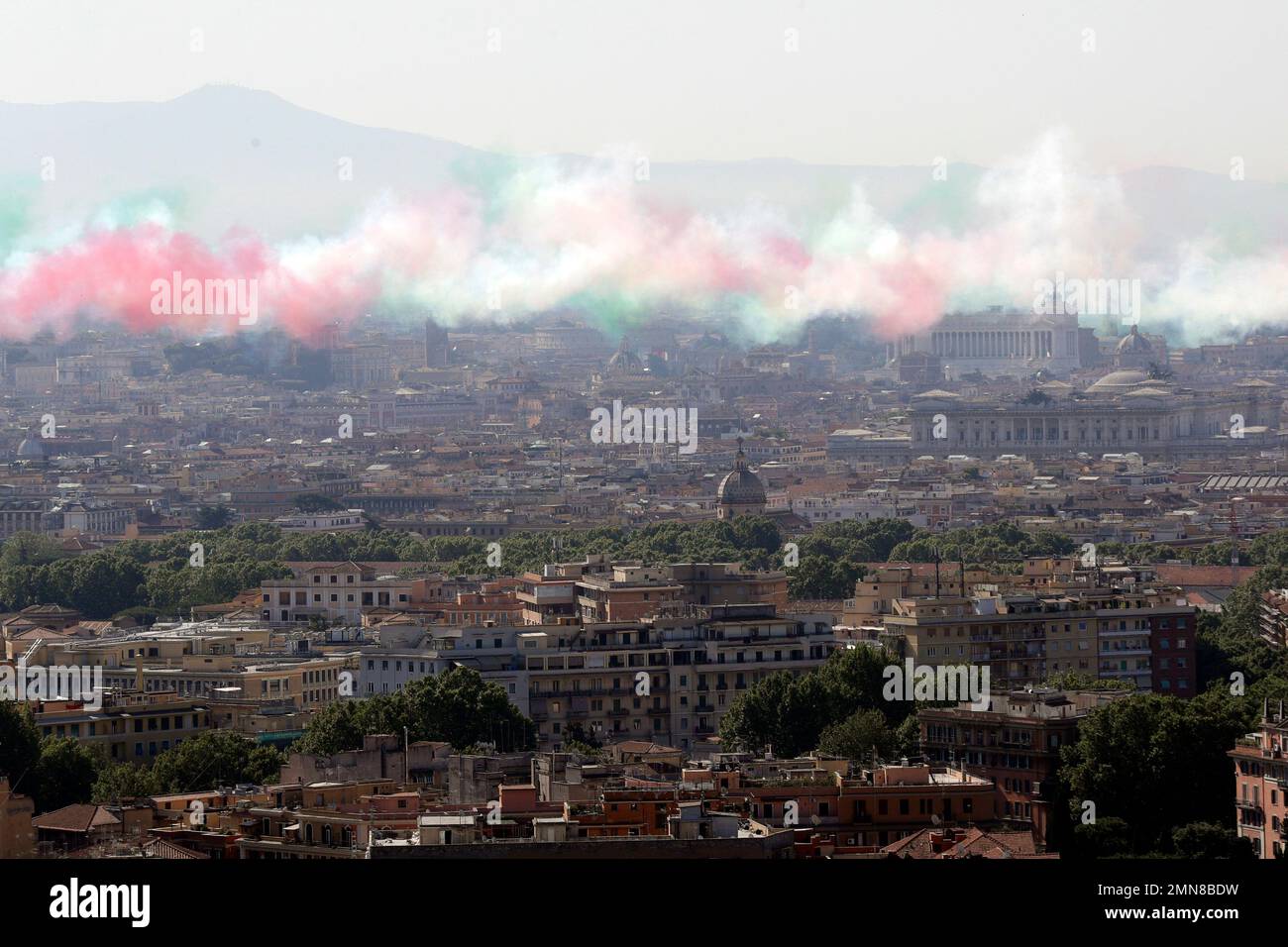 Smoke in the colors of the Italian flag is left behind after the flying ...