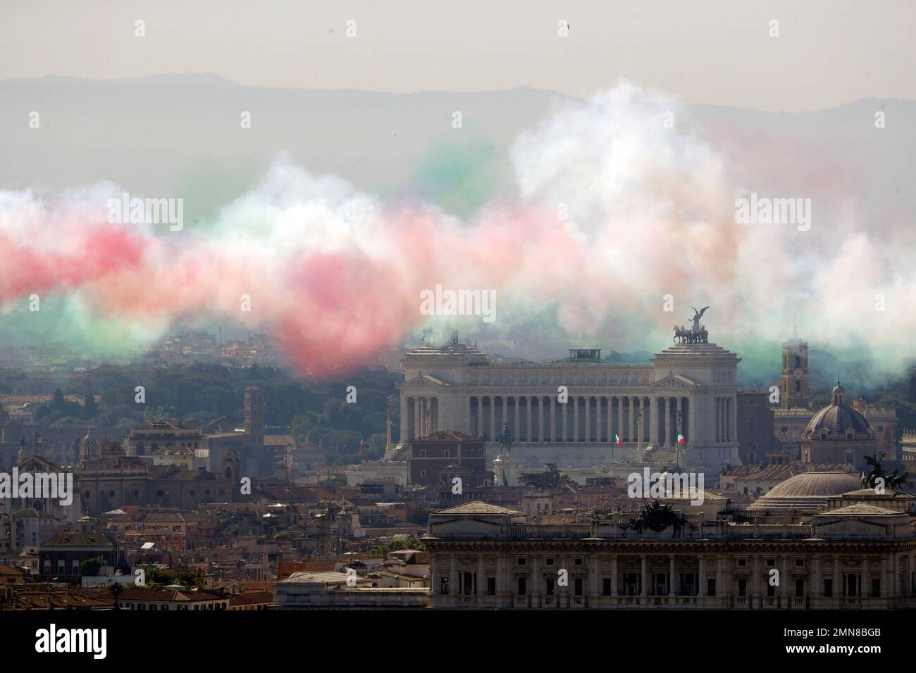 Smoke in the colors of the Italian flag is left behind after the flying ...