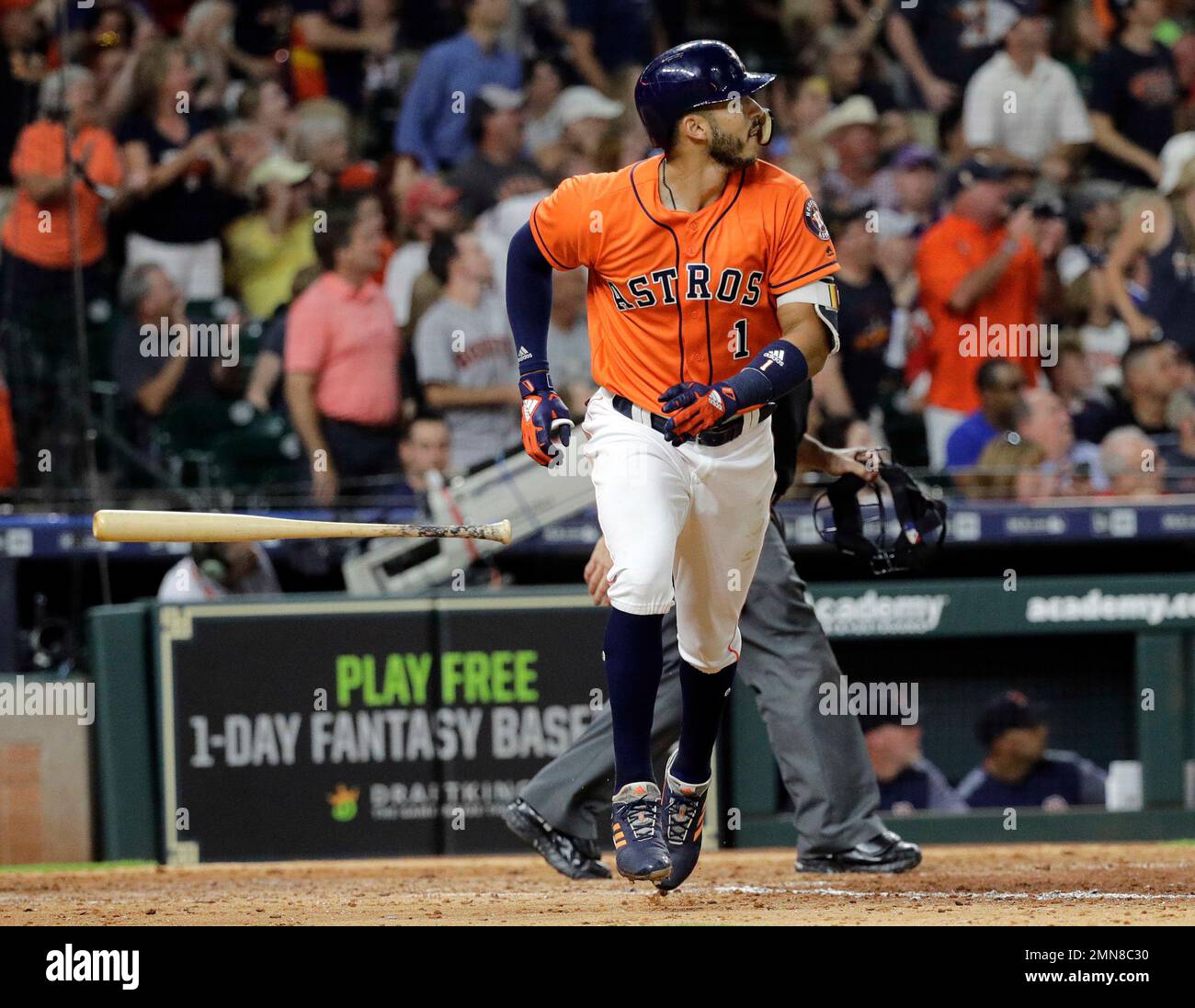 Houston Astros' Carlos Correa (1) tosses his bat after hitting a home ...