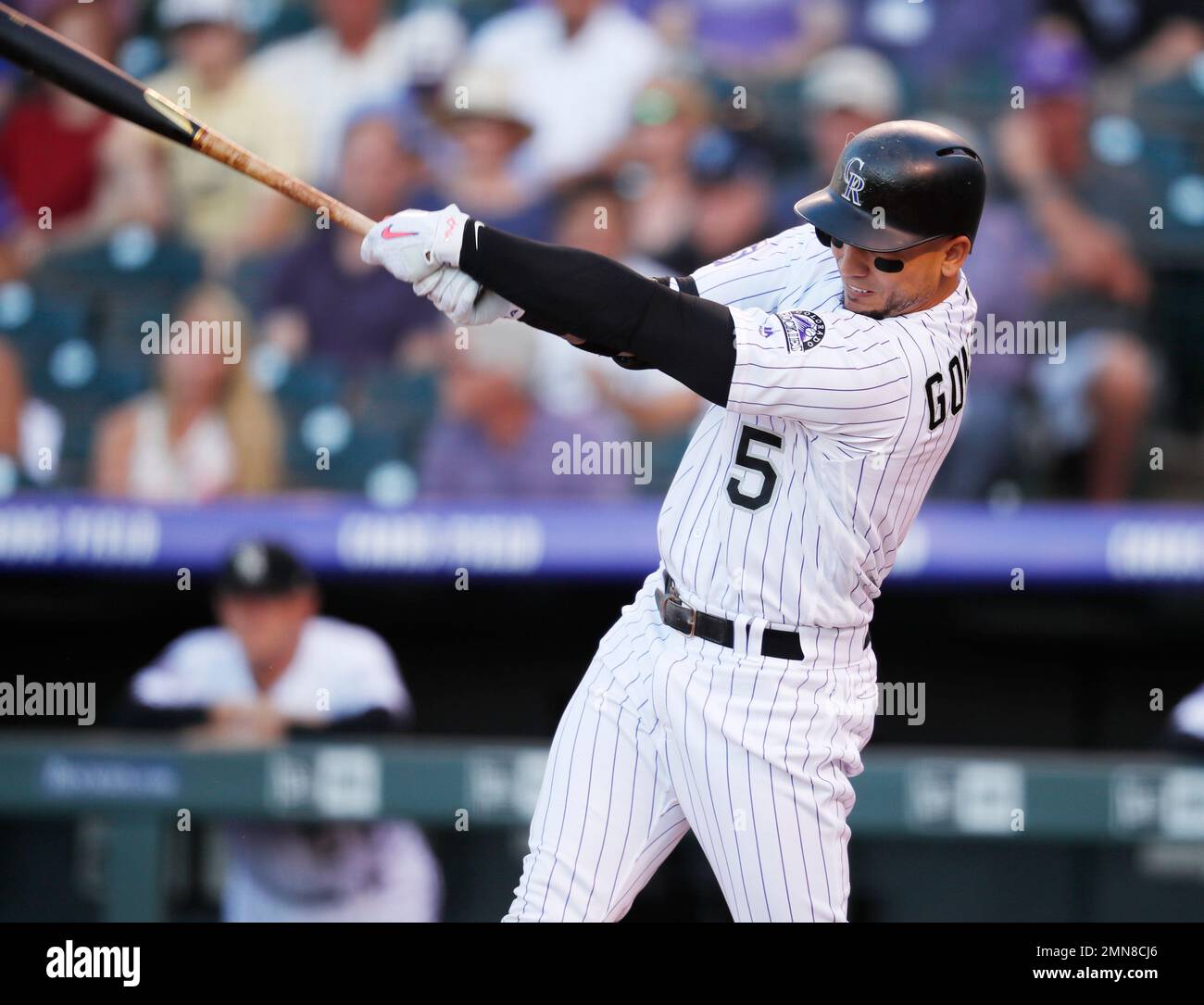 Colorado Rockies' Carlos Gonzalez connects for an RBI-triple off Los ...