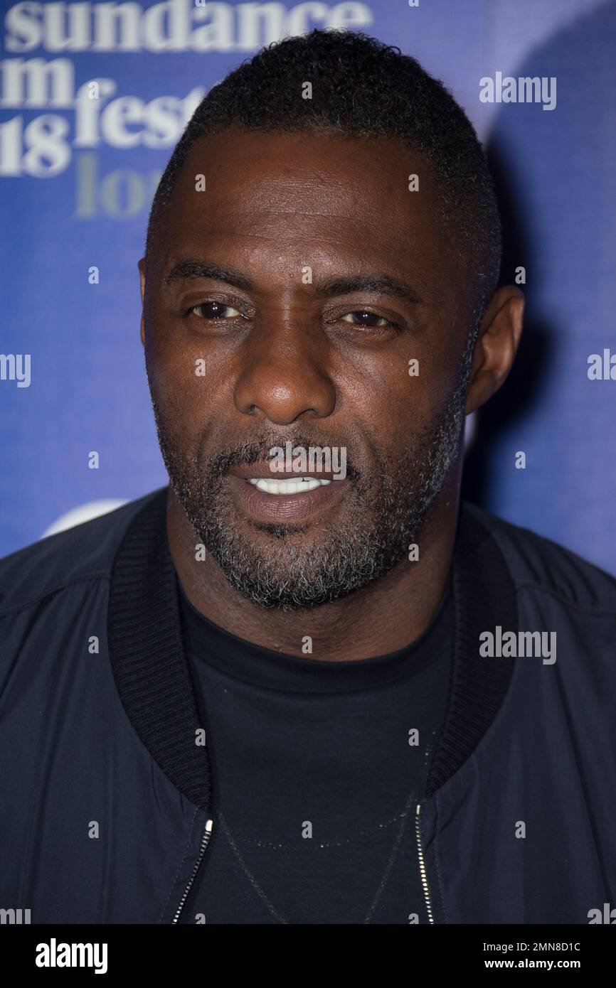 Director Idris Elba poses for photographers upon arrival at a photo ...
