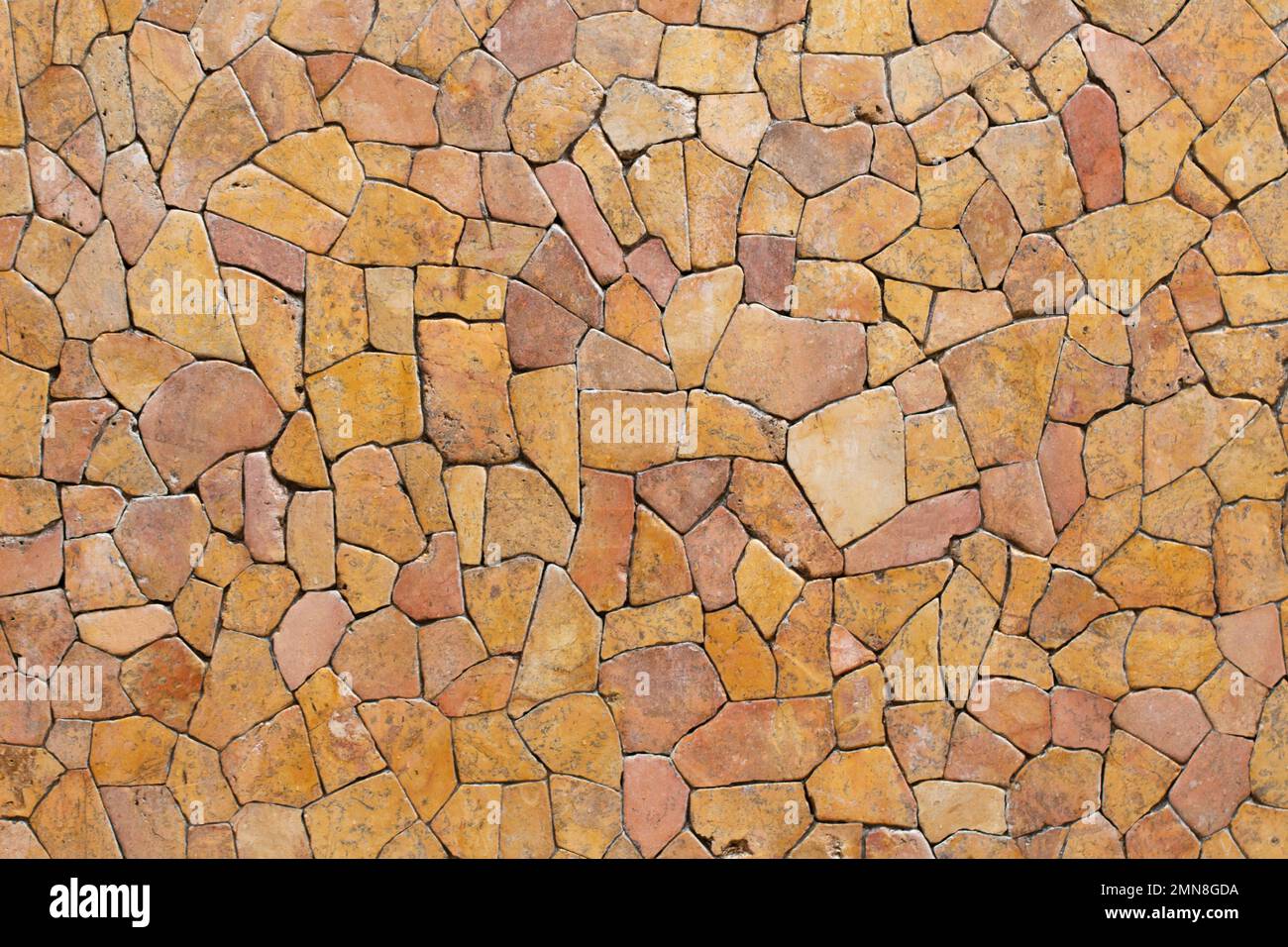 Mosaic stone wall texture background Stock Photo - Alamy