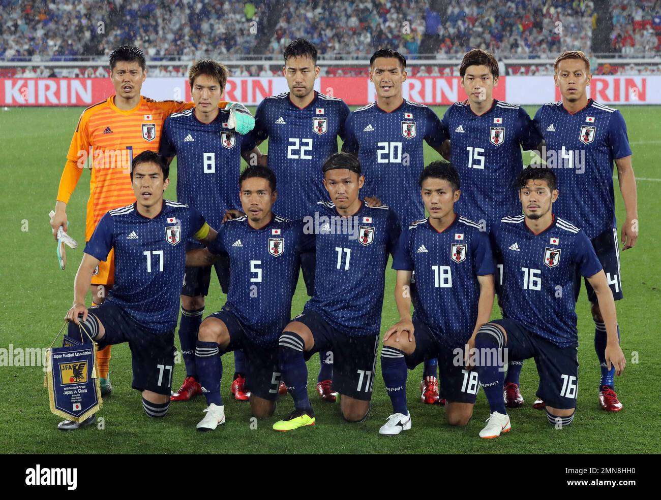 Japan's players lines up for a group photo prior to a friendly soccer ...