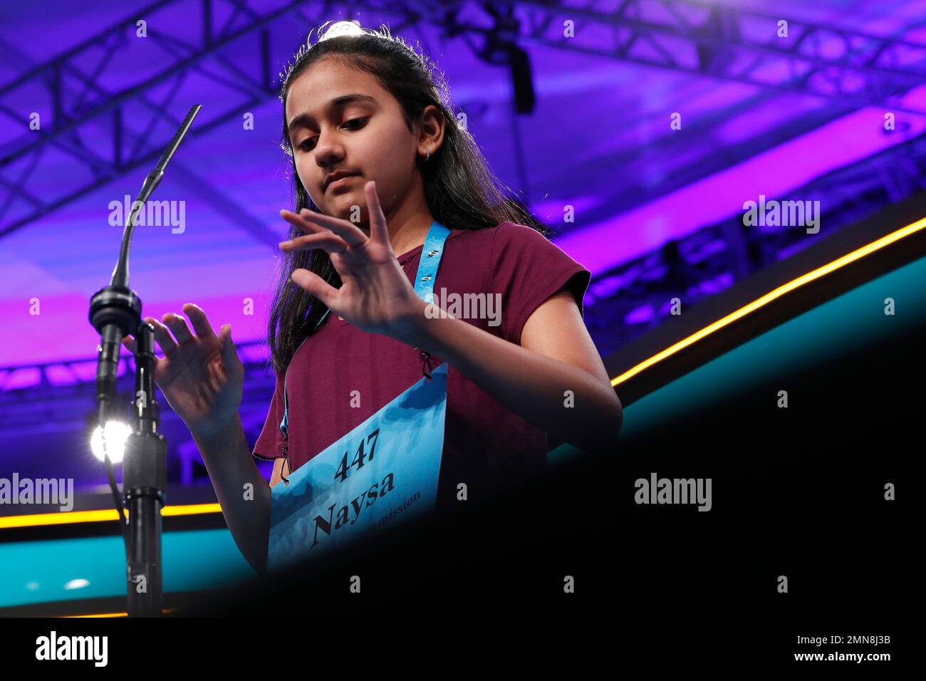 Naysa Modi, 12, from Frisco, Texas, types her word in the air while ...