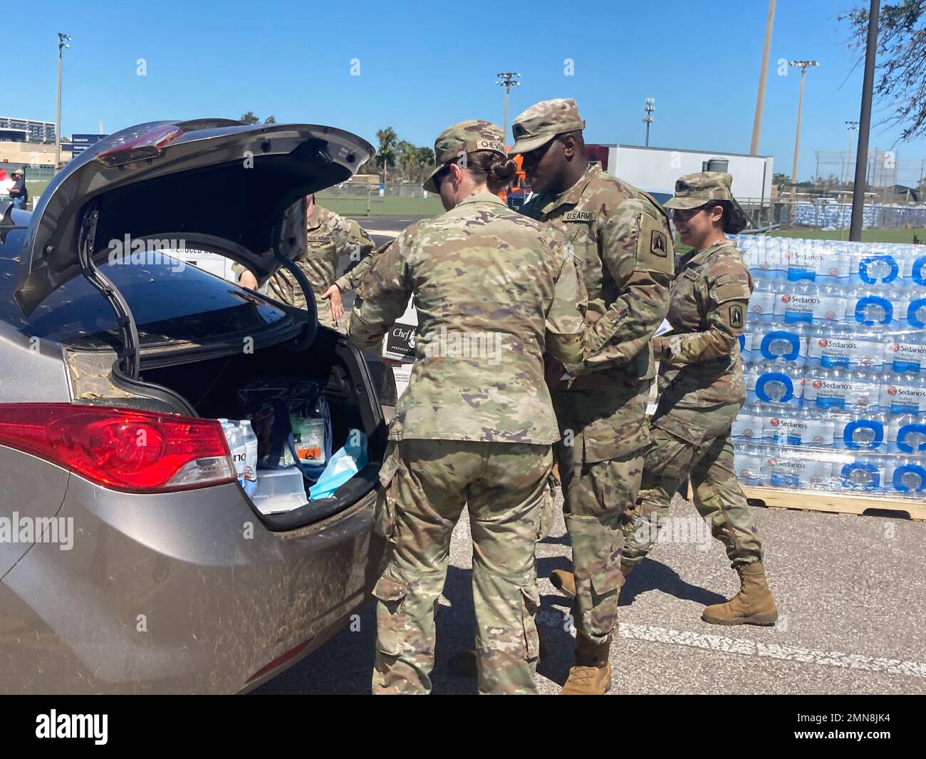 Soldiers from the 3-116th Field Artillery Battalion are distributing ...