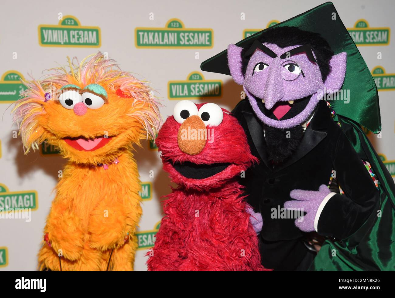 Sesame Street characters Zoe, left, Elmo and The Count pose together at ...