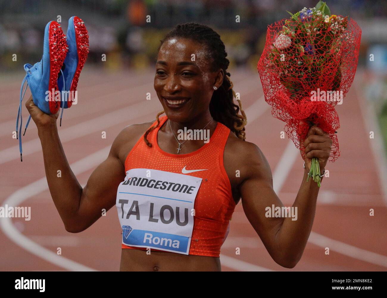 Ivory Coast's Marie-Josee Ta Lou celebrates after winning the women's ...