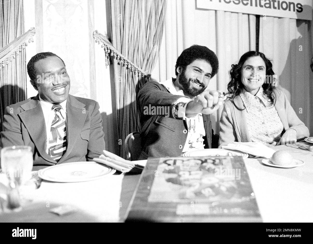 Franco Harris of the Pittsburgh Steelers is flanked by his father, Cad ...