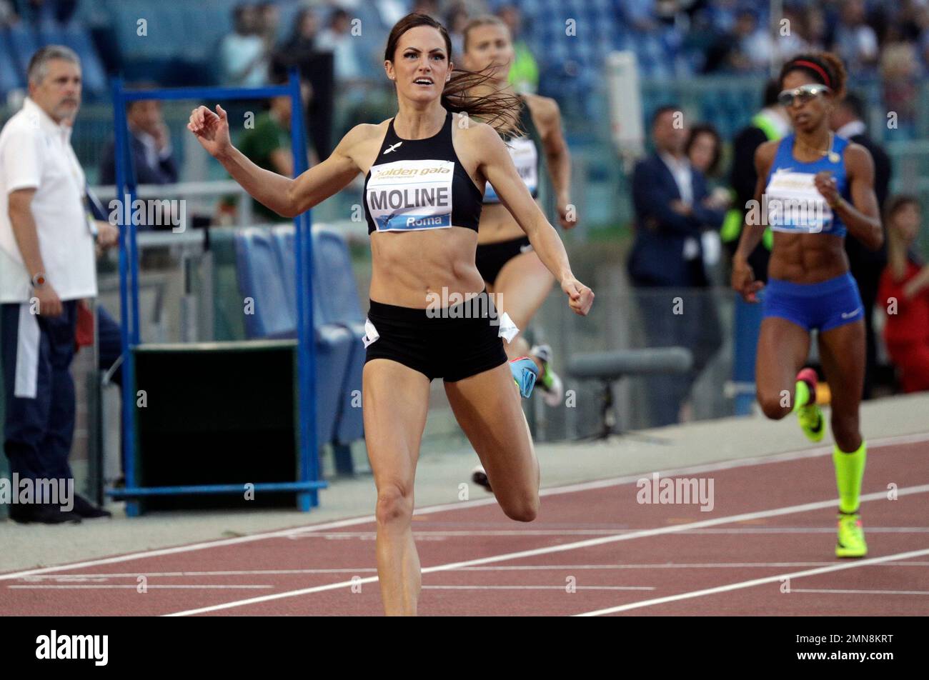 Georganne Moline of the United States crosses the finish line to win ...