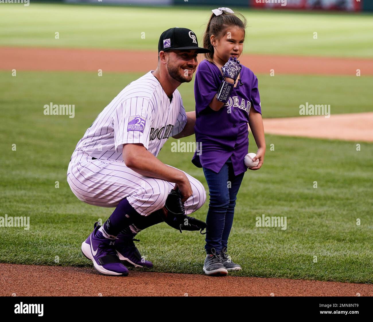Hailey Dawson, 8, from Las Vegas throws out the first pitch before the ...