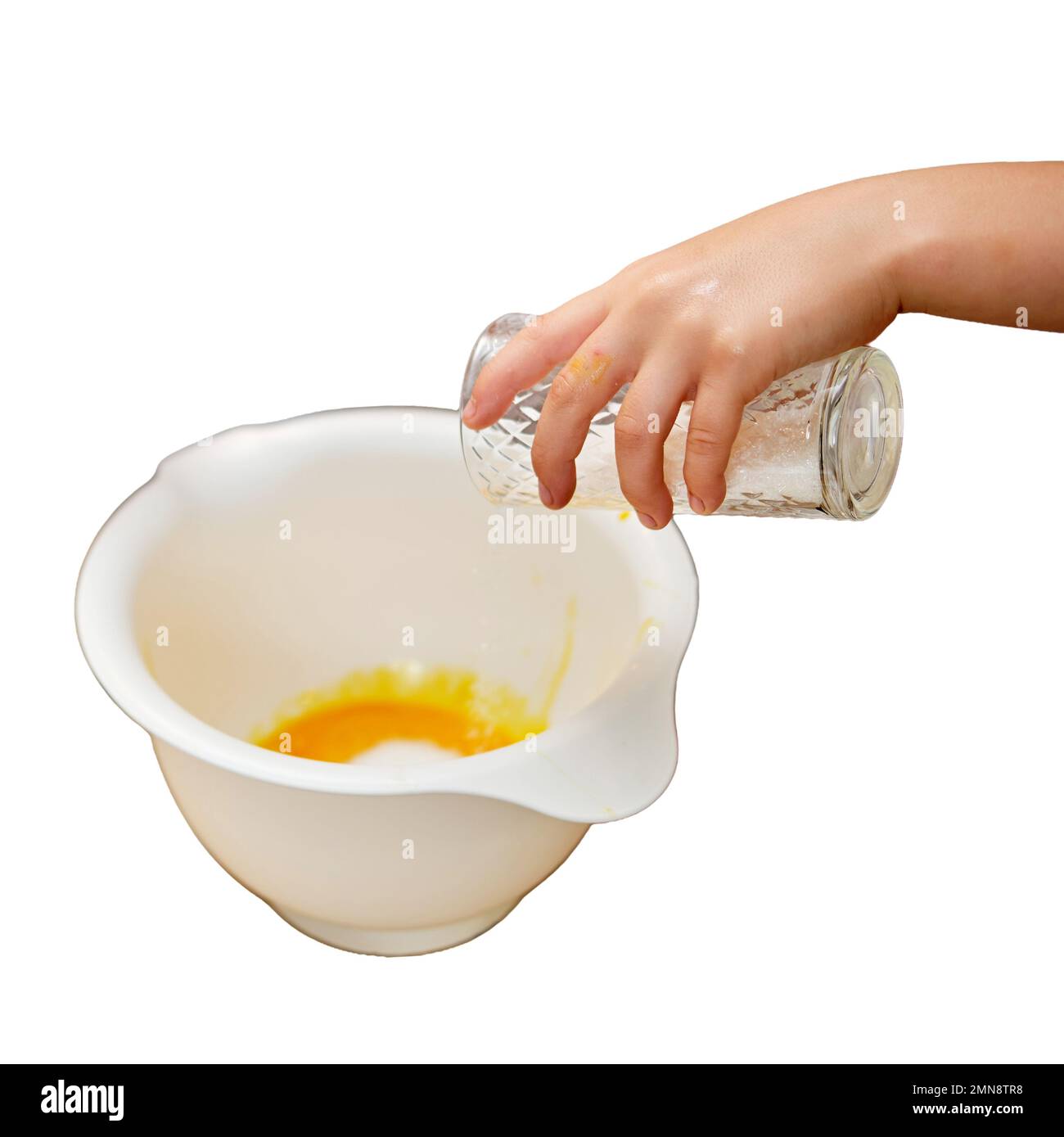 A child boy cooks food in a home kitchen, isolated on a white ...