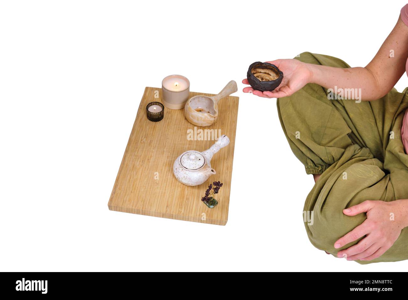 Woman hold a Chinese tea ceremony with a teapot, isolated on a white ...