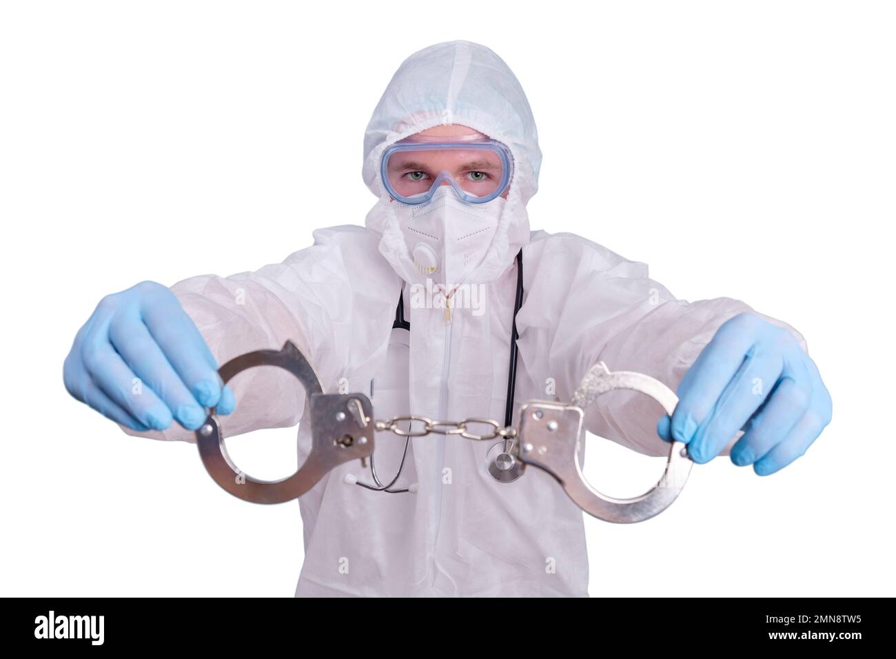 A paramedic in a protective uniform in a medical face mask with ...