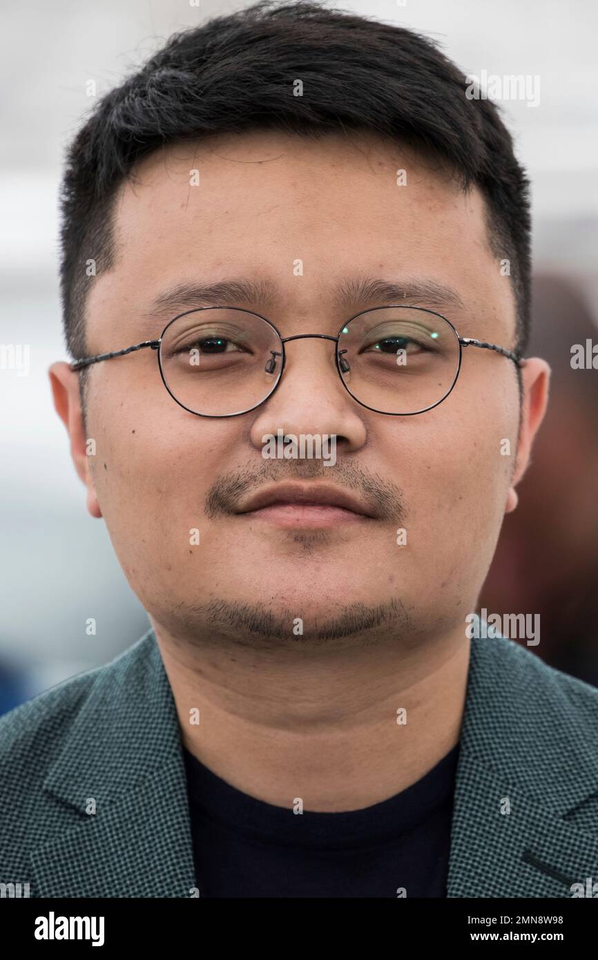Bi Gan poses for photographers during a photo call for the film 'Long ...