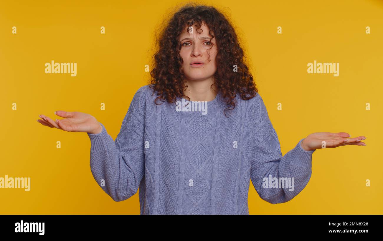 I dont know what to say. Confused woman feeling embarrassed about ...