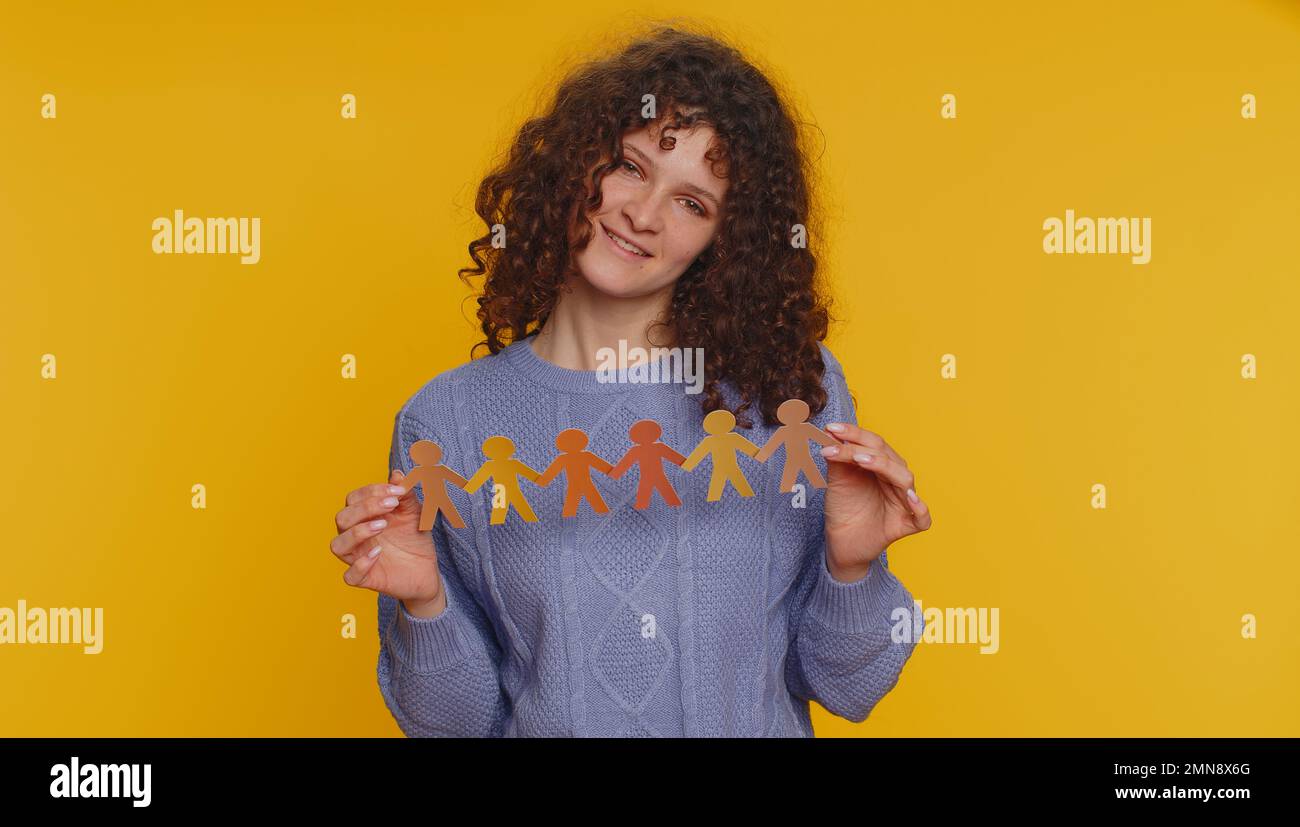 Woman showing multiracial different skin color human shape cut out of ...