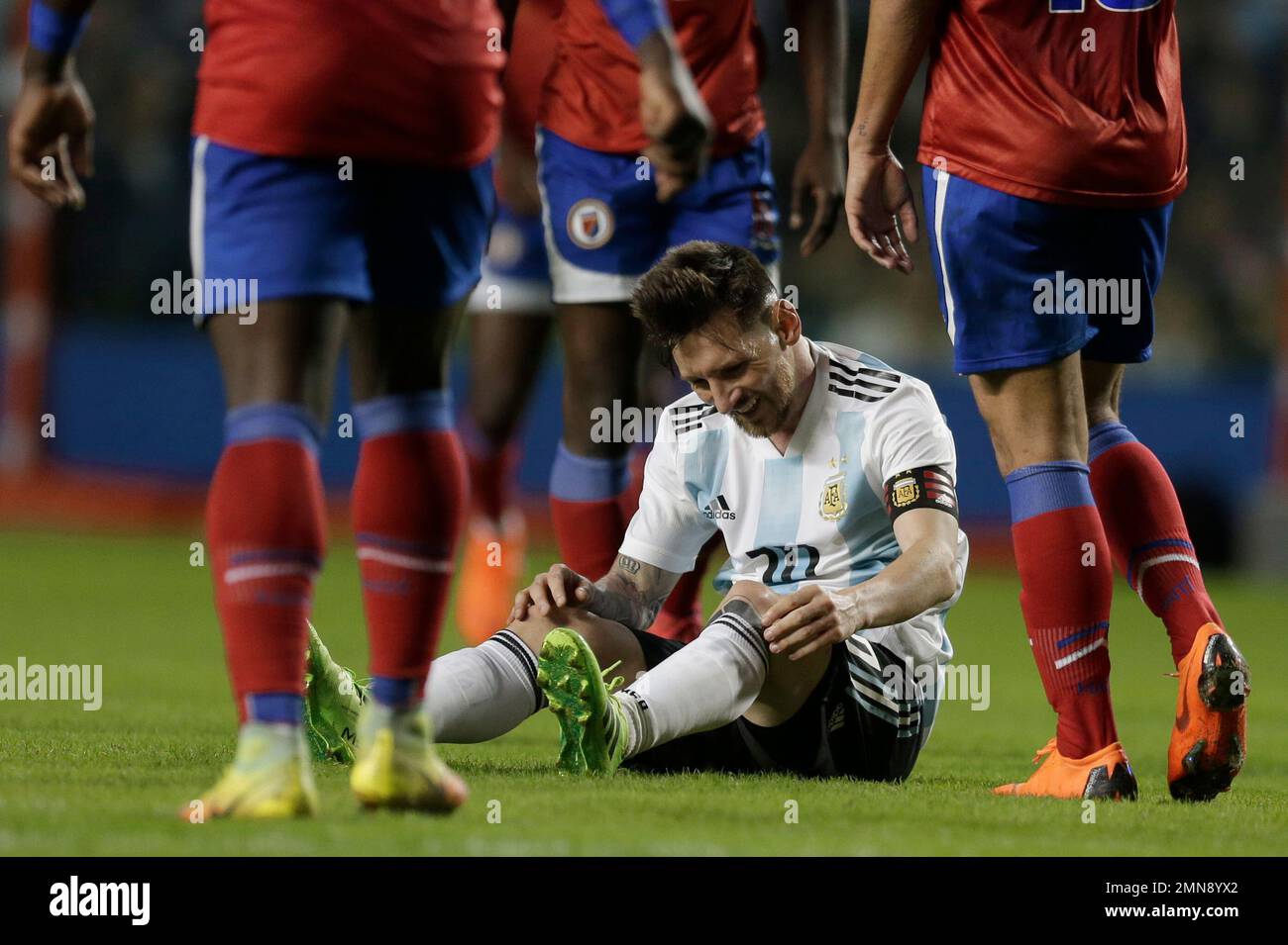 Argentina's Lionel Messi laughs surrounded by Haiti players during a ...