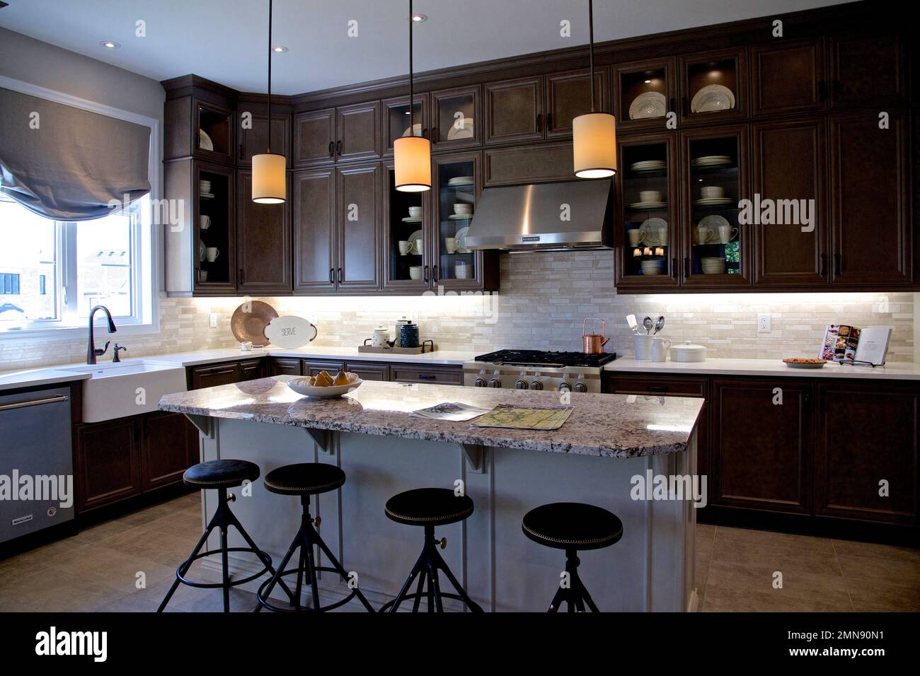 View of a newly designed kitchen with a kitchen center island inside a ...