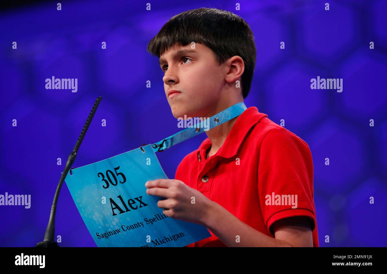 Alexander Christian, 11, from Saginaw, Mich., uses his name placard to ...