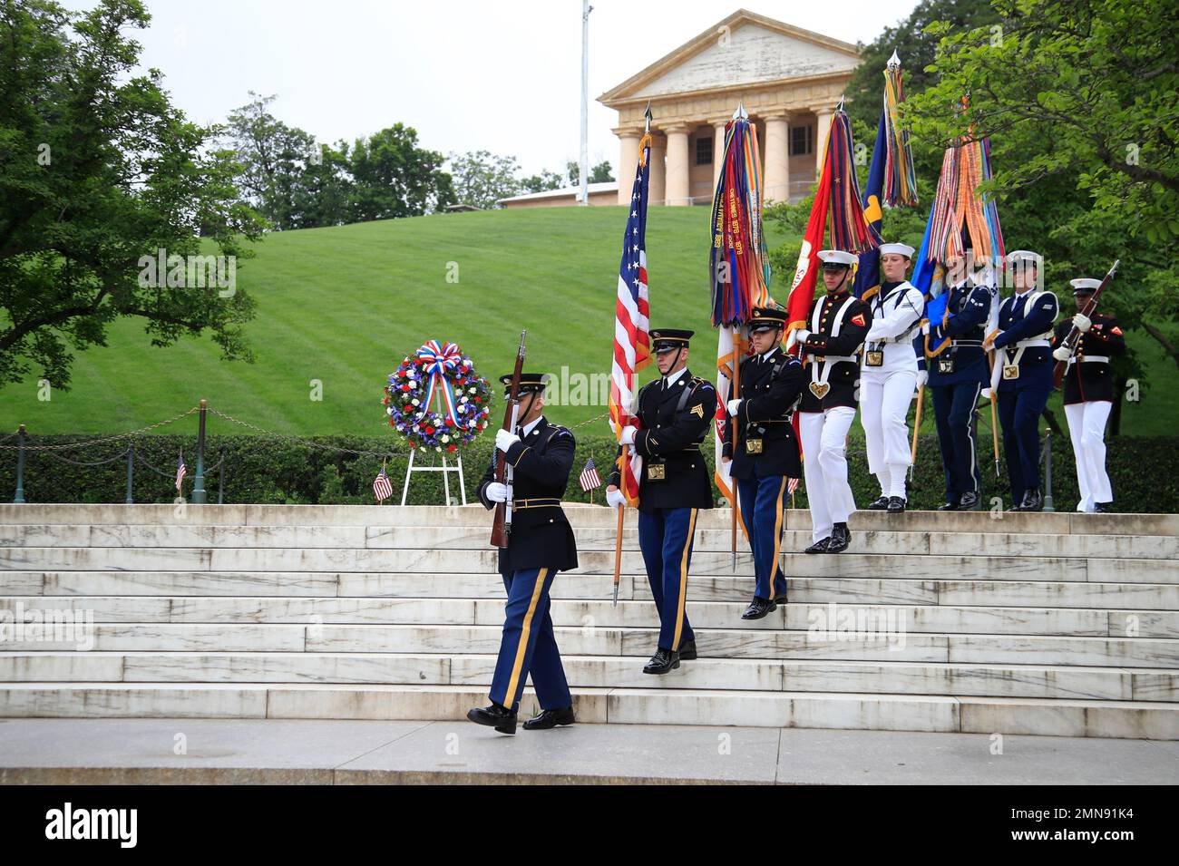 Color guards from different branches of the U.S. Armed Forces, march ...