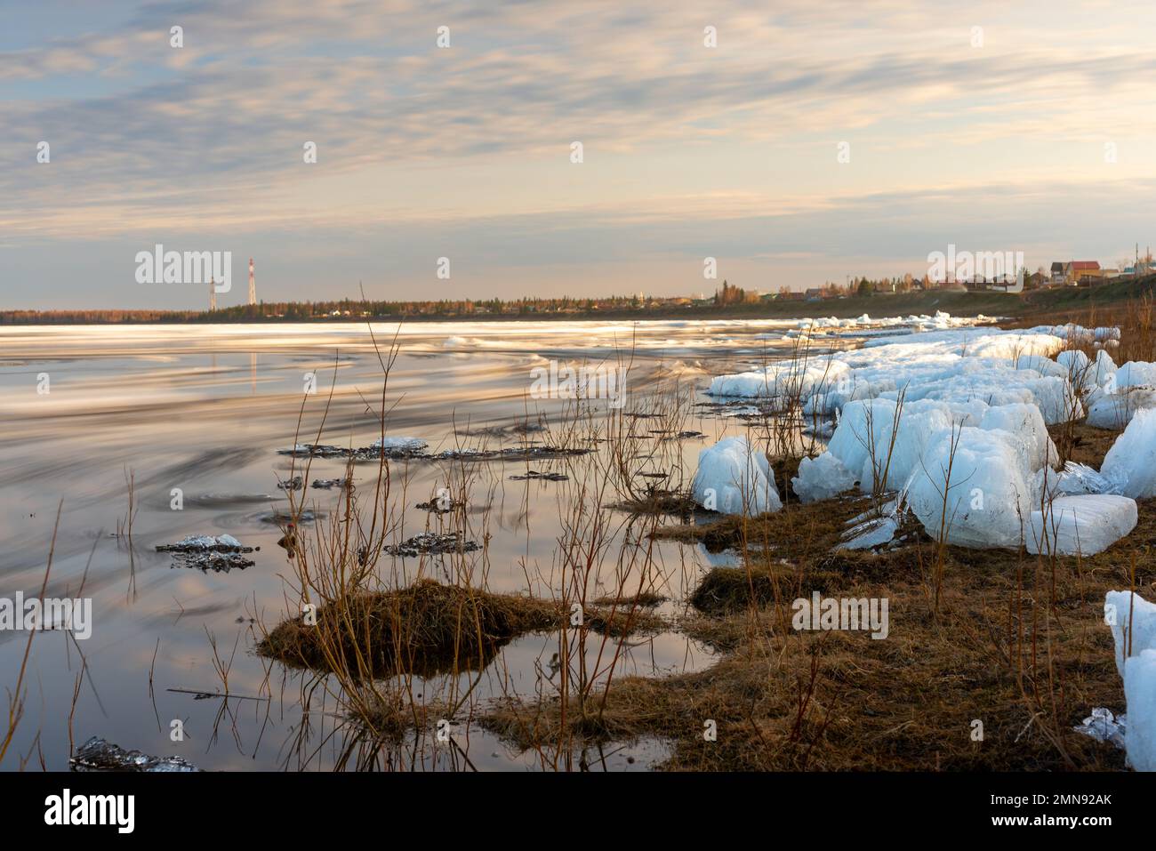 Ice drift on the spring river Vilyui in Yakutia at sunset in the ...