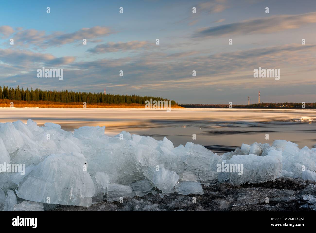 Ice movement on the spring river Vilyui in Yakutia at sunset against ...